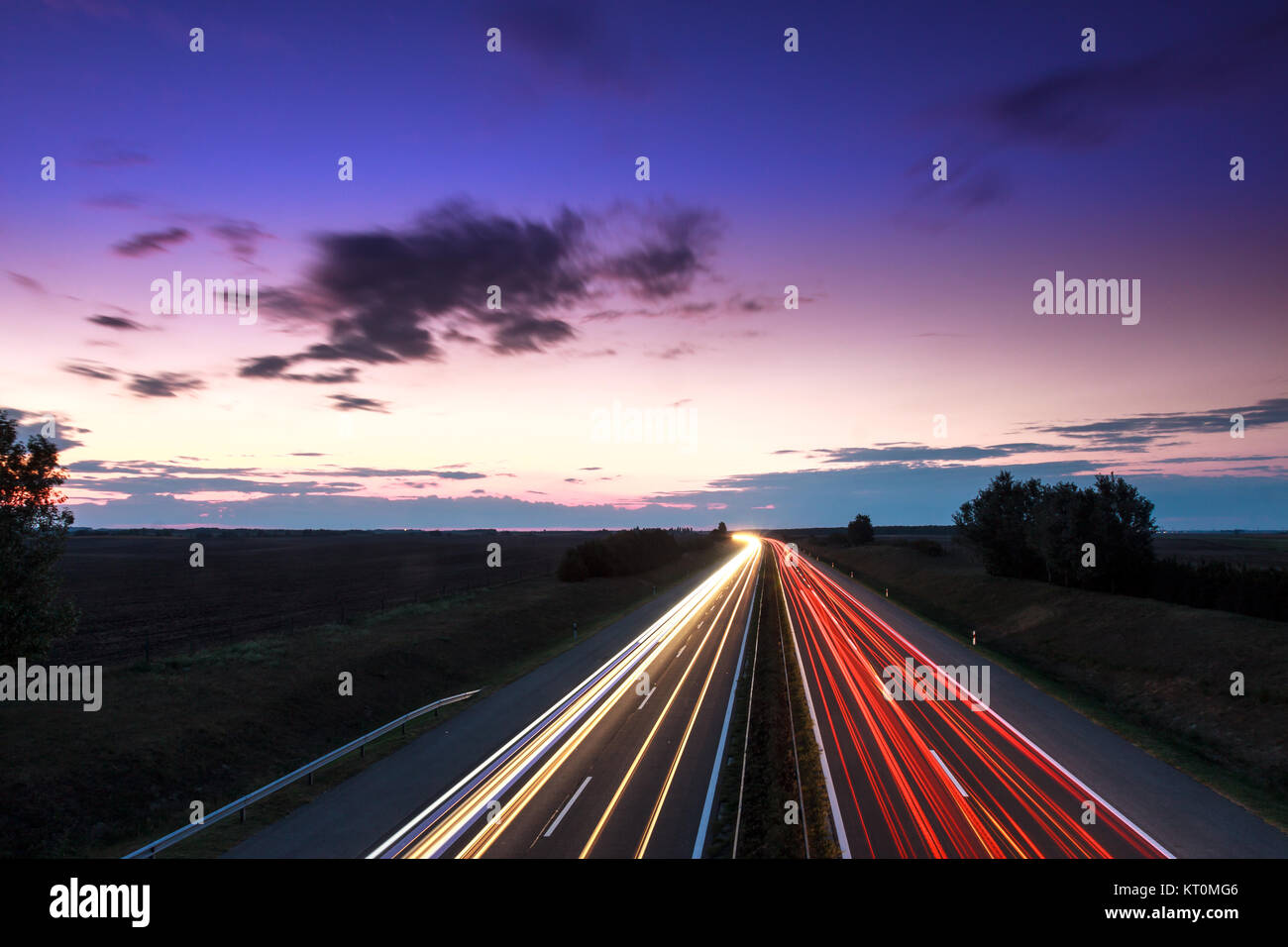 Cars speeding on a highway Stock Photo - Alamy