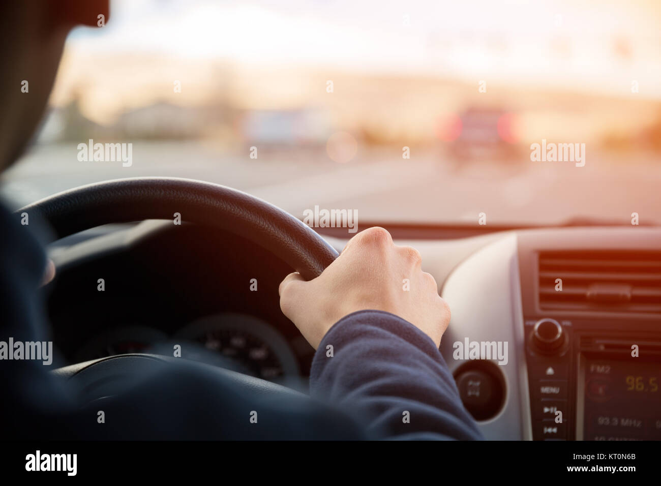 Driving car hands on steering wheel Stock Photo - Alamy