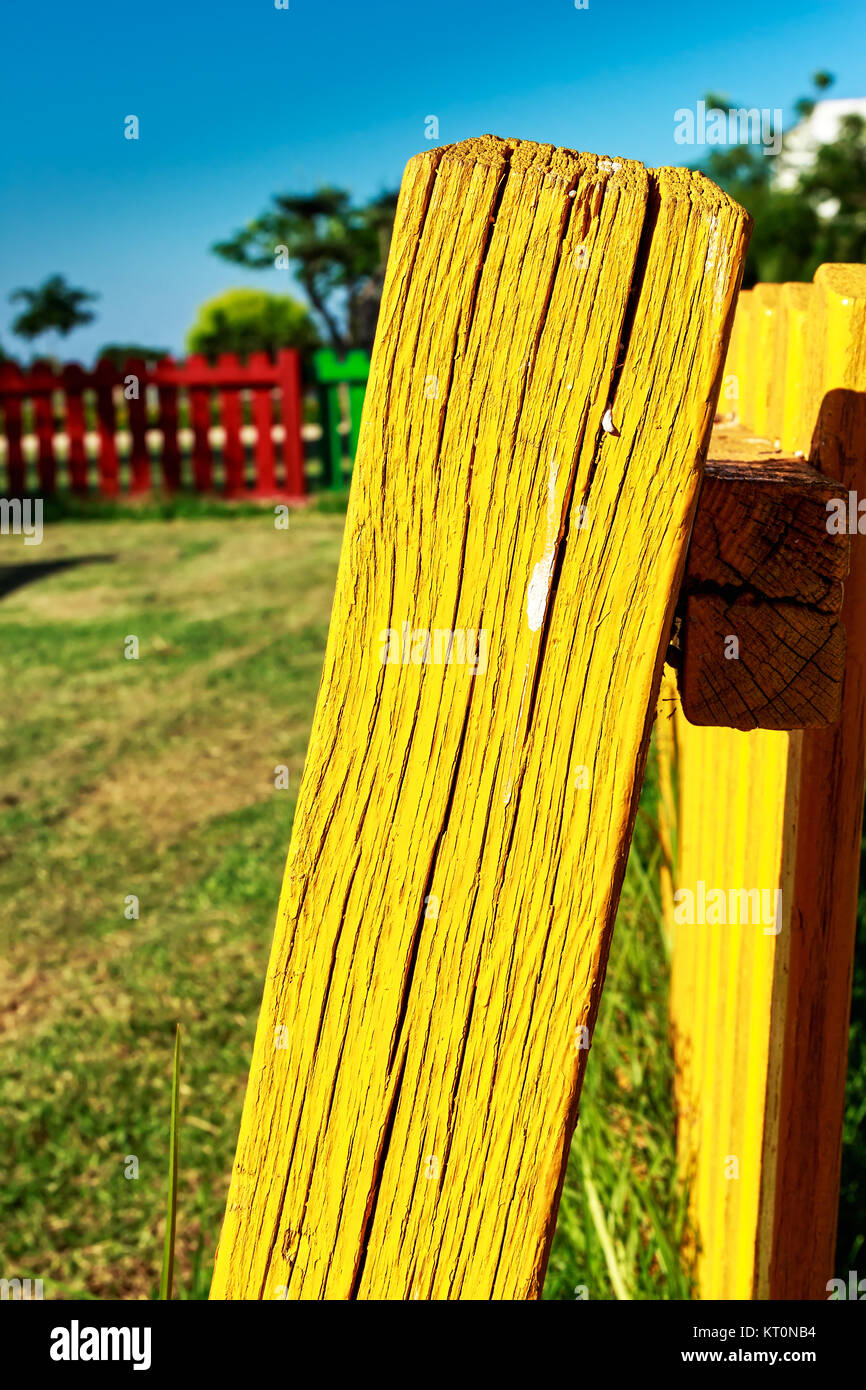 Yellow fence post Stock Photo - Alamy