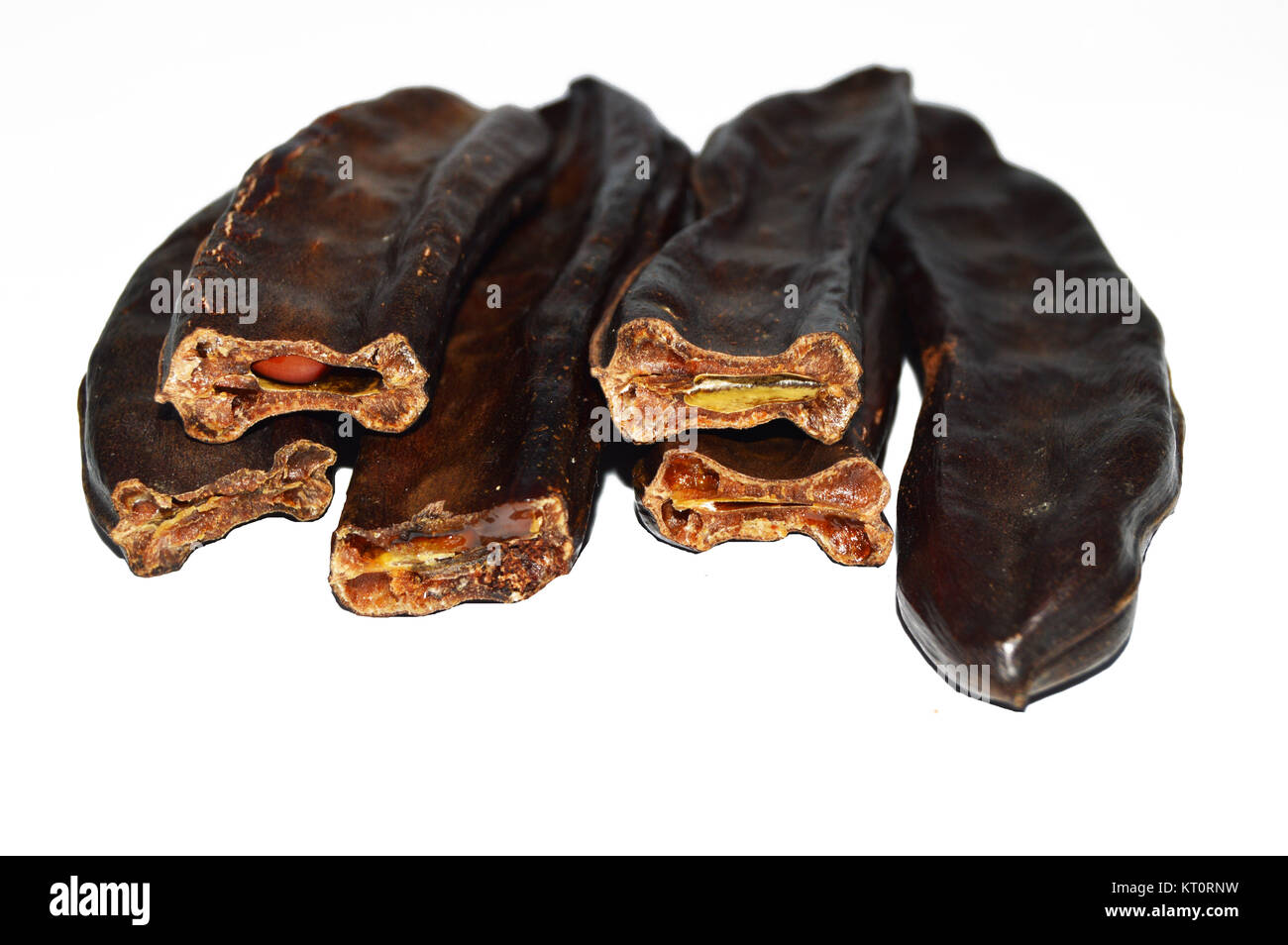 Dried carob fruit close up Cut Out Stock Images & Pictures - Alamy