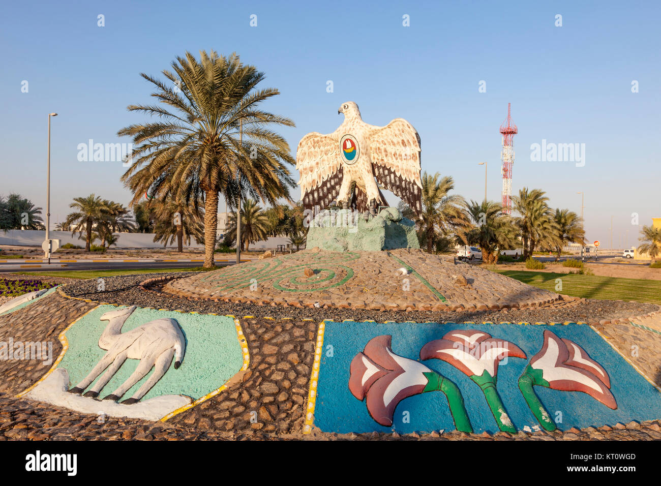 Falcon monument in a roundabout in the city of Madinat Zayed. Emirate ...