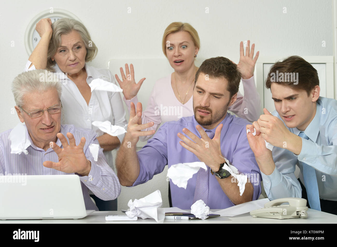 people throwing paper sheets in laptop Stock Photo - Alamy