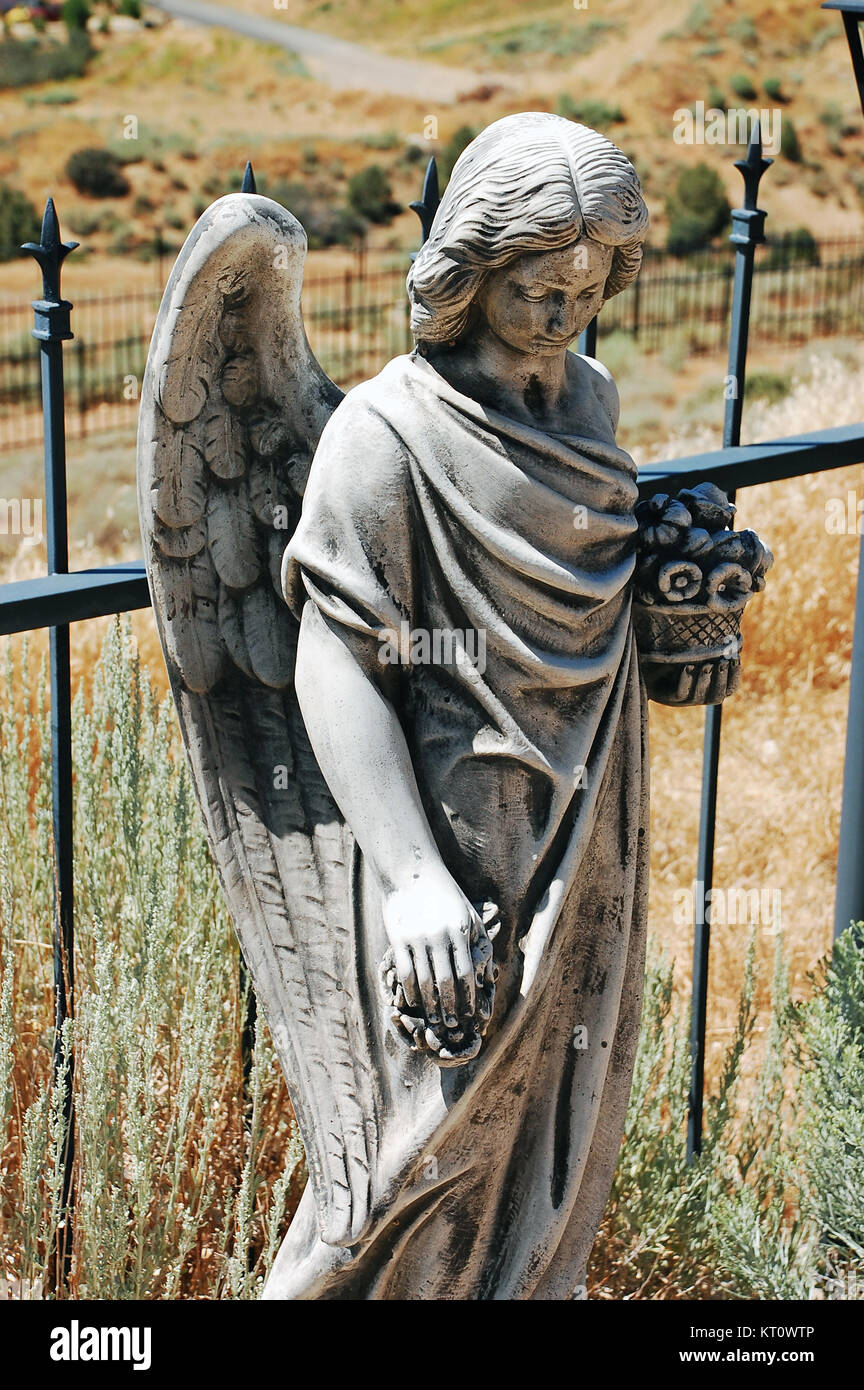 Sad angel headstone in cemetery Stock Photo - Alamy