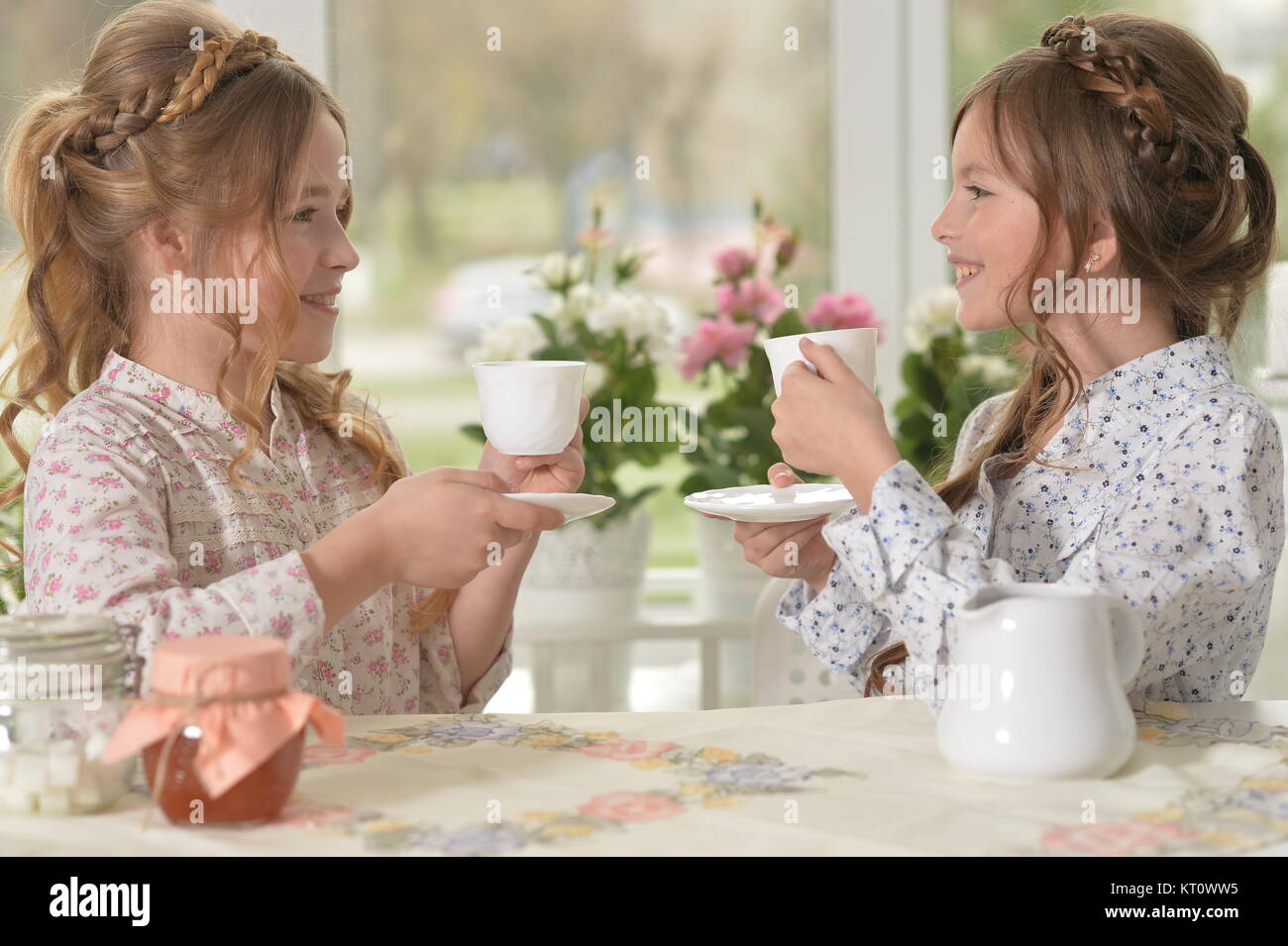 little girls drinking tea Stock Photo - Alamy