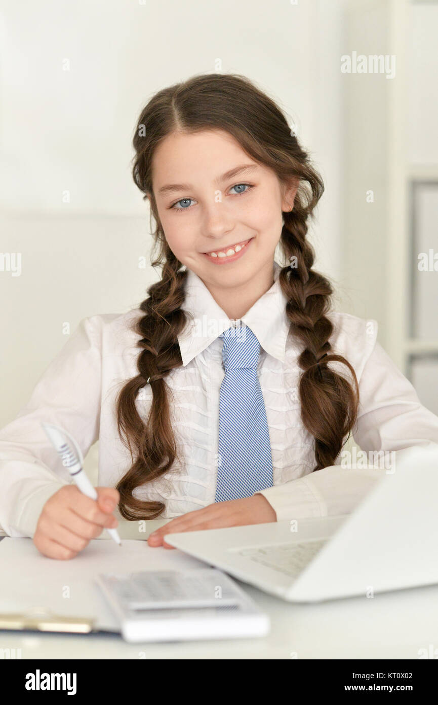 Cute girl doing homework Stock Photo - Alamy