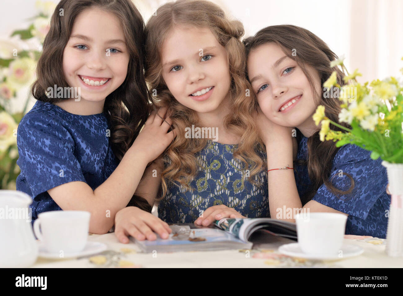 Three little cute girls Stock Photo - Alamy