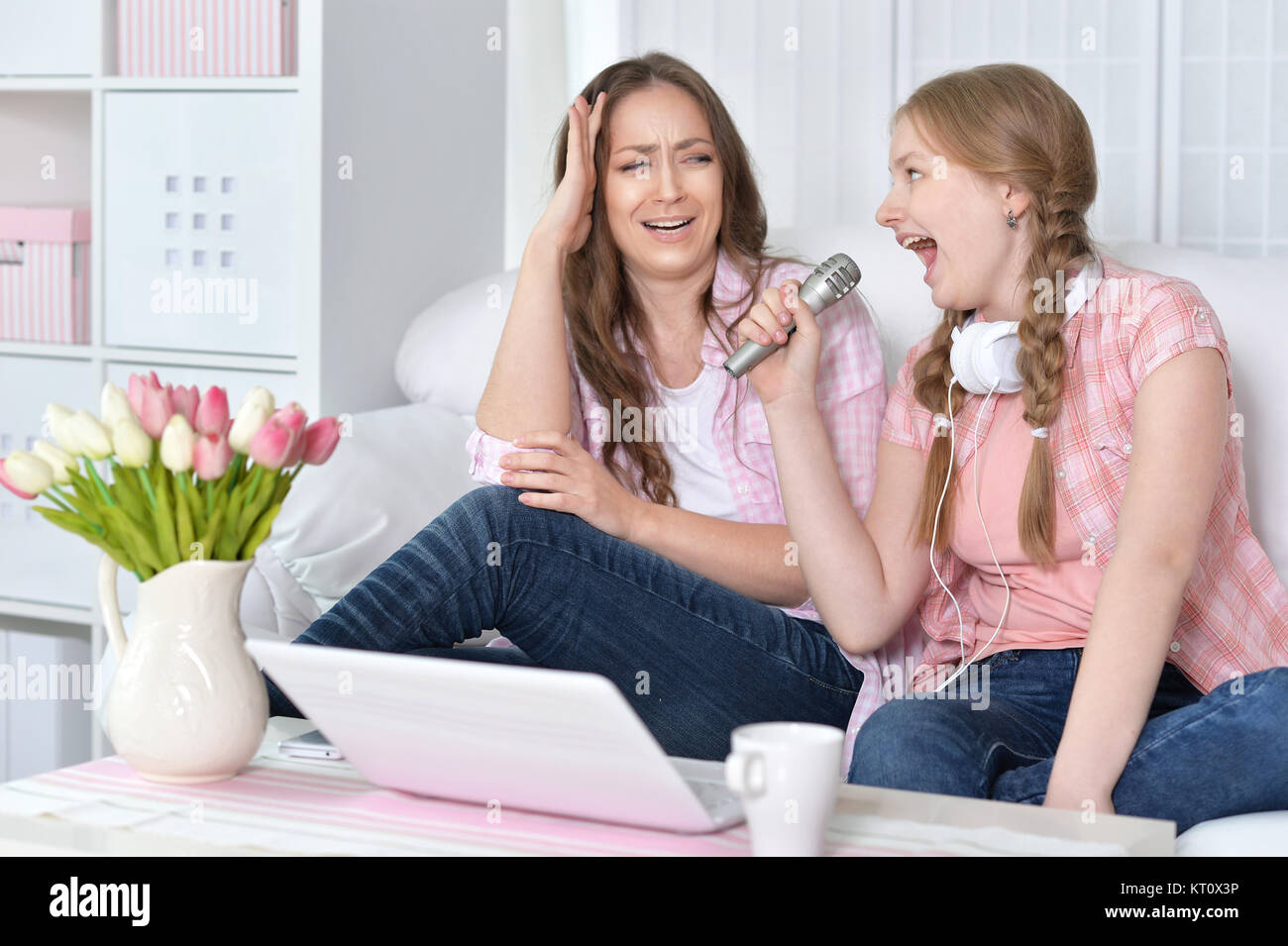 Mother daughter singing karaoke hi-res stock photography and images - Alamy