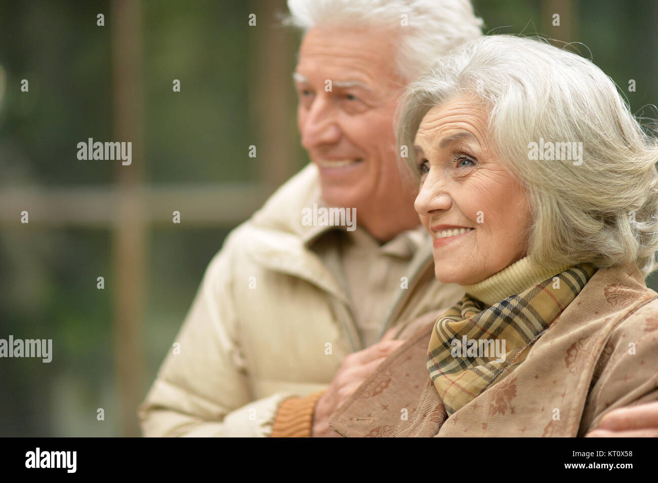 senior couple hugging in the park Stock Photo - Alamy