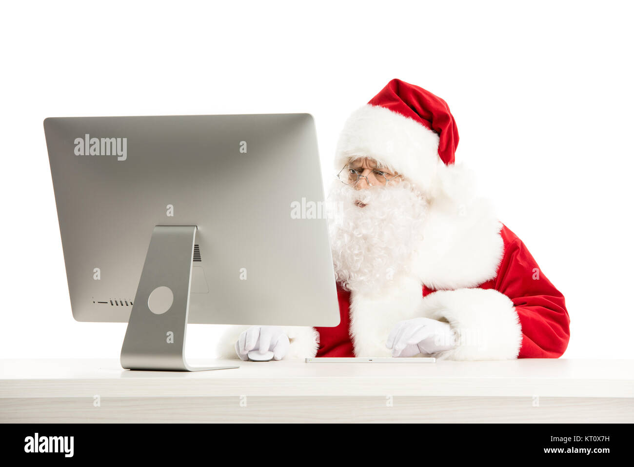 Santa Claus working on computer Stock Photo - Alamy