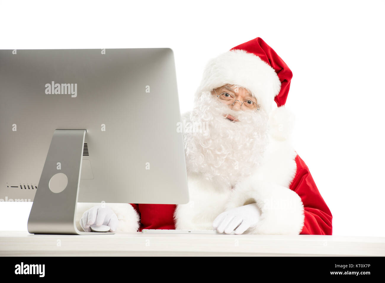 Santa Claus sitting at the desk with computer Stock Photo - Alamy