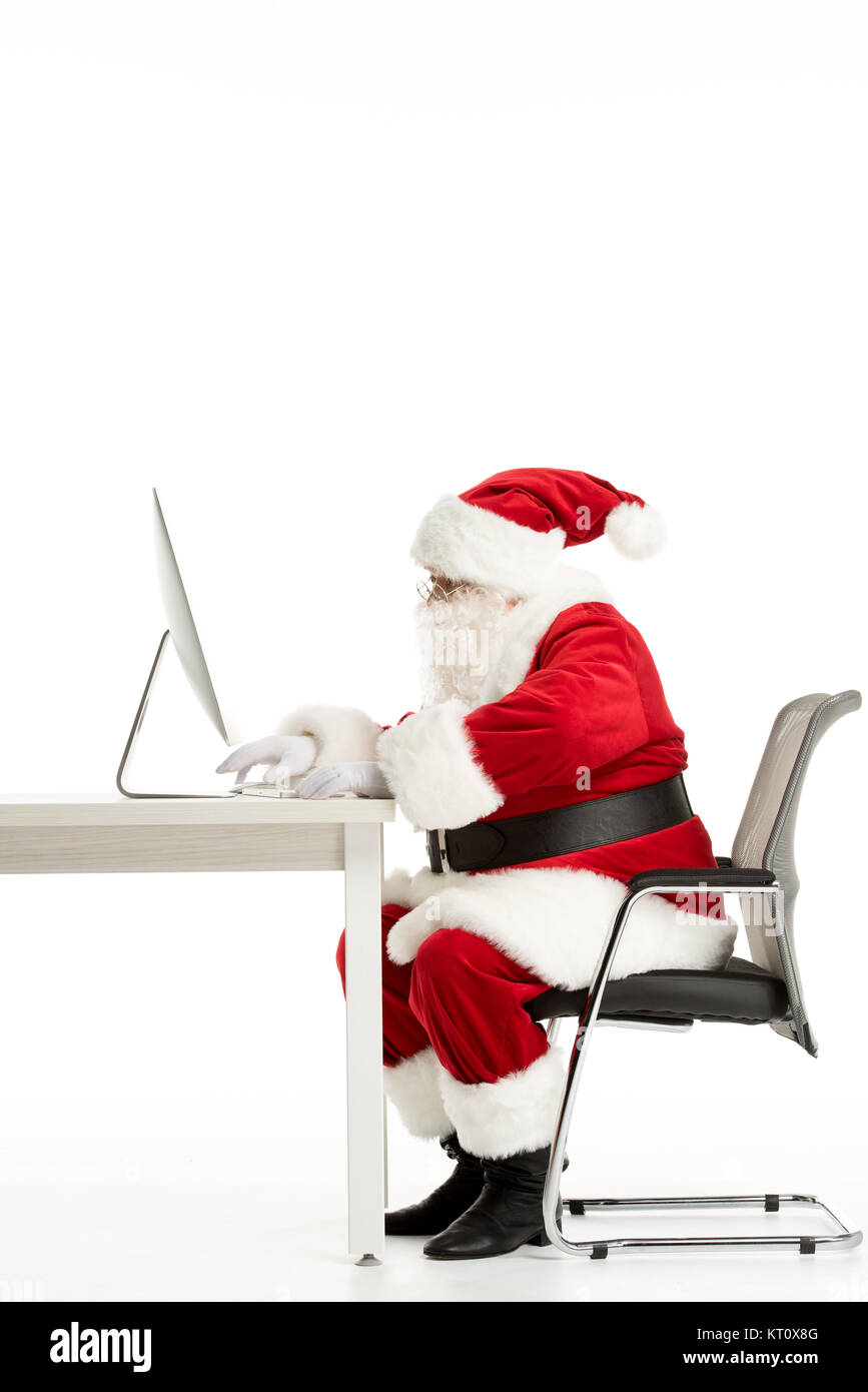 Santa Claus using computer Stock Photo - Alamy