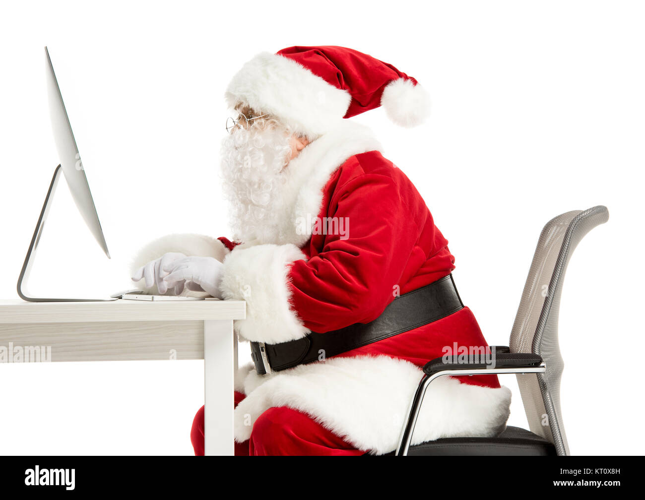 Santa Claus working on computer Stock Photo - Alamy