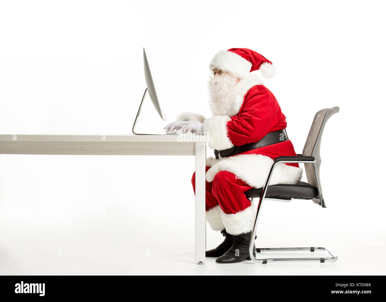 Santa Claus using computer Stock Photo - Alamy