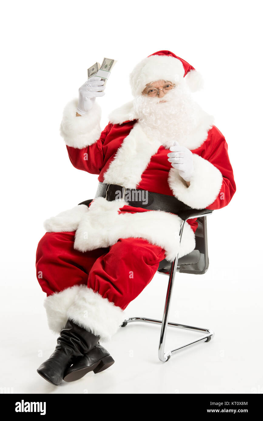 Happy Santa Claus holding money Stock Photo - Alamy