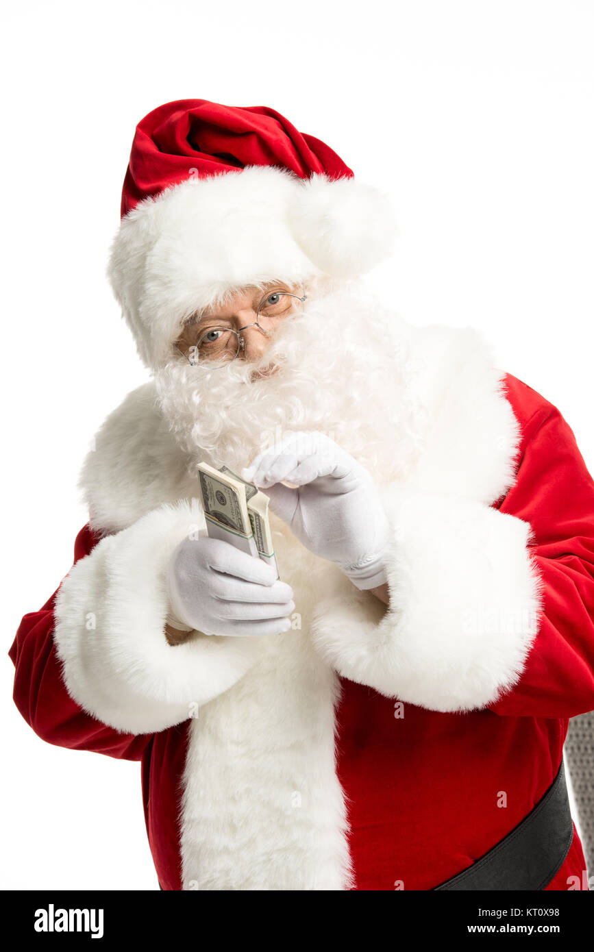 Santa Claus counting dollar banknotes Stock Photo - Alamy