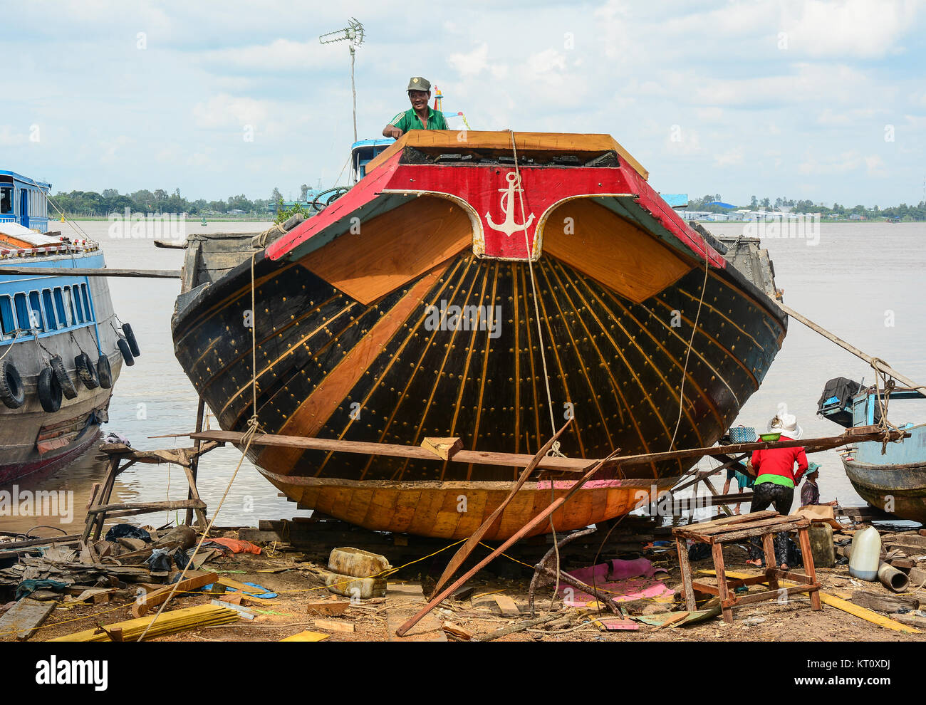 An Giang, Vietnam - Oct 2, 2015. Wooden cargo boat building at shipyard ...