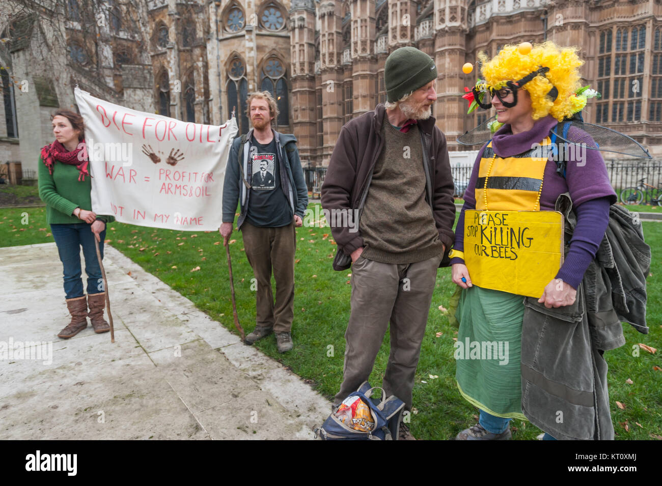 A campaigner dressed as a bee and anti-war for oil protesters at ...