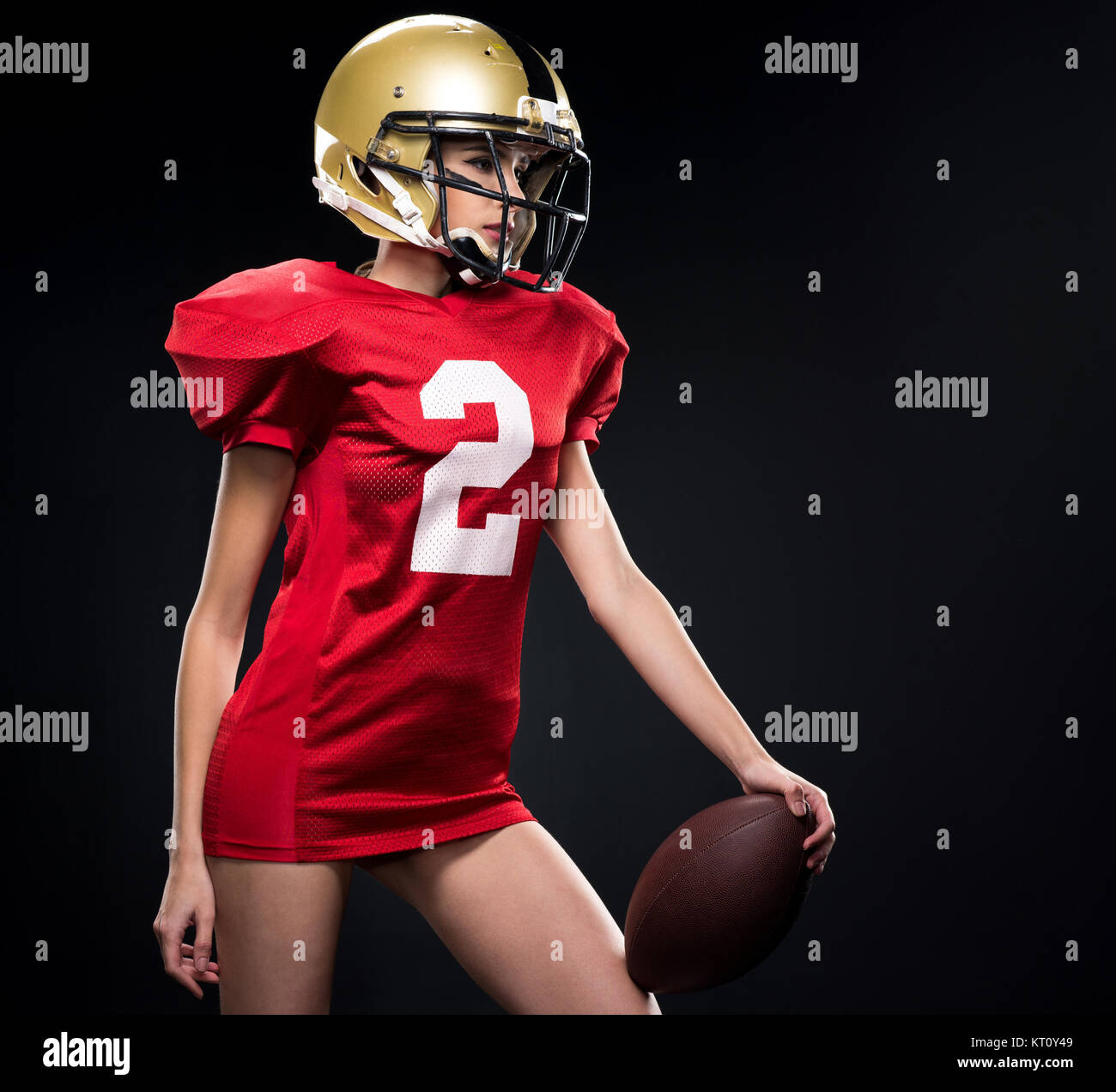 Female american football player in sportswear Stock Photo - Alamy