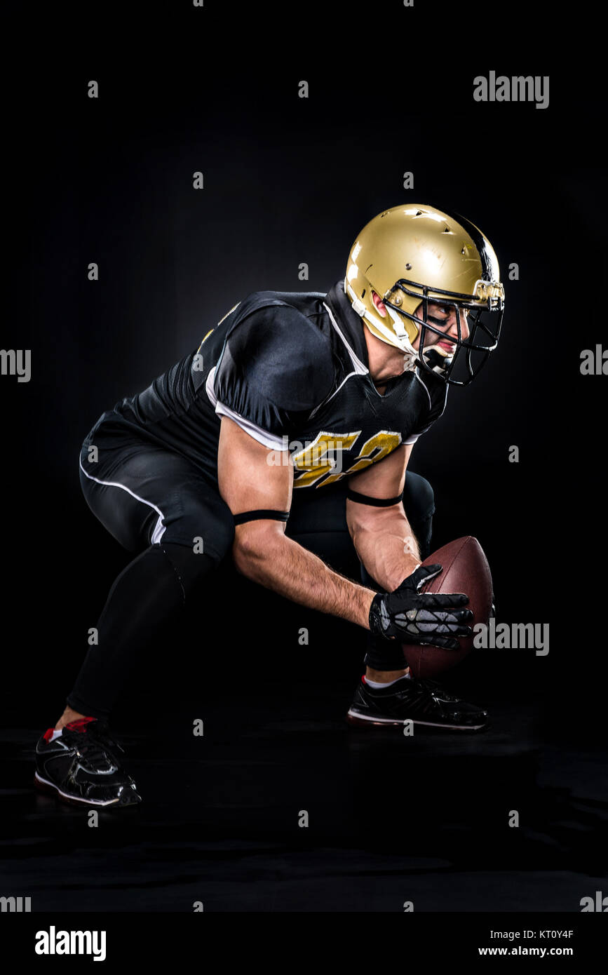 American football player crouching Stock Photo - Alamy