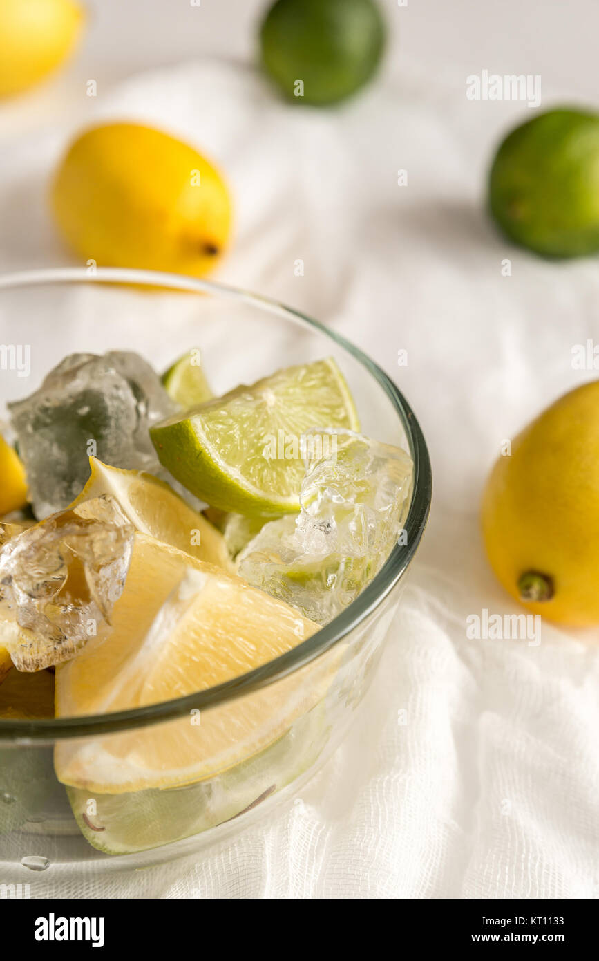 Lemons and limes on the white background Stock Photo - Alamy