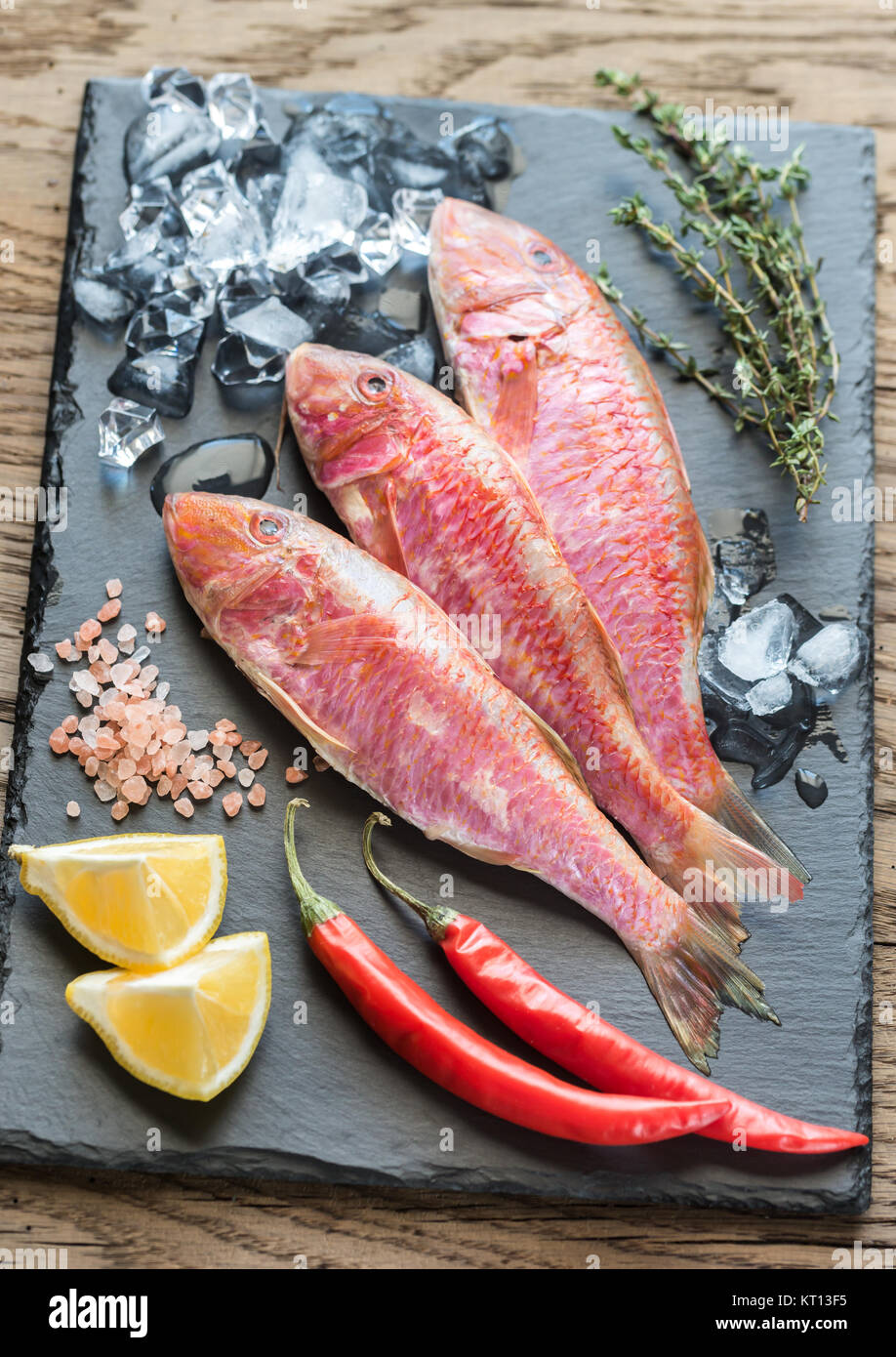 Raw red mullet with ingredients Stock Photo - Alamy