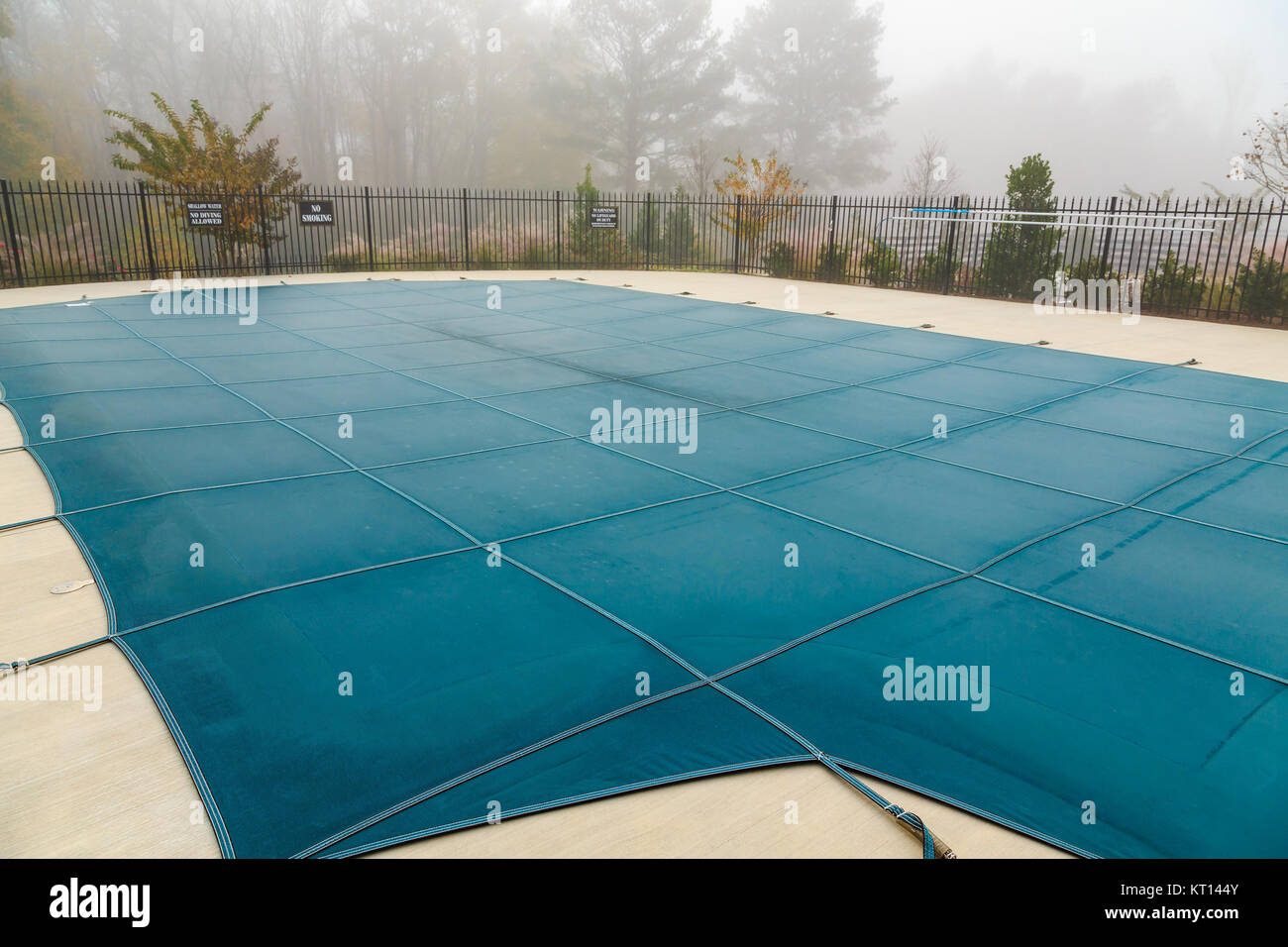 A Blue Vinyl Pool Cover in Fog Stock Photo - Alamy