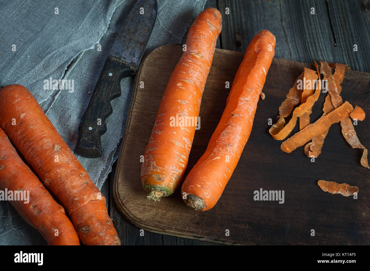whole big carrot on the kitchen board, top view Stock Photo - Alamy