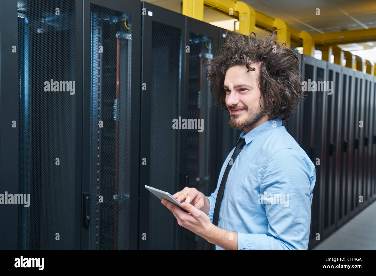 Young technician working Stock Photo - Alamy