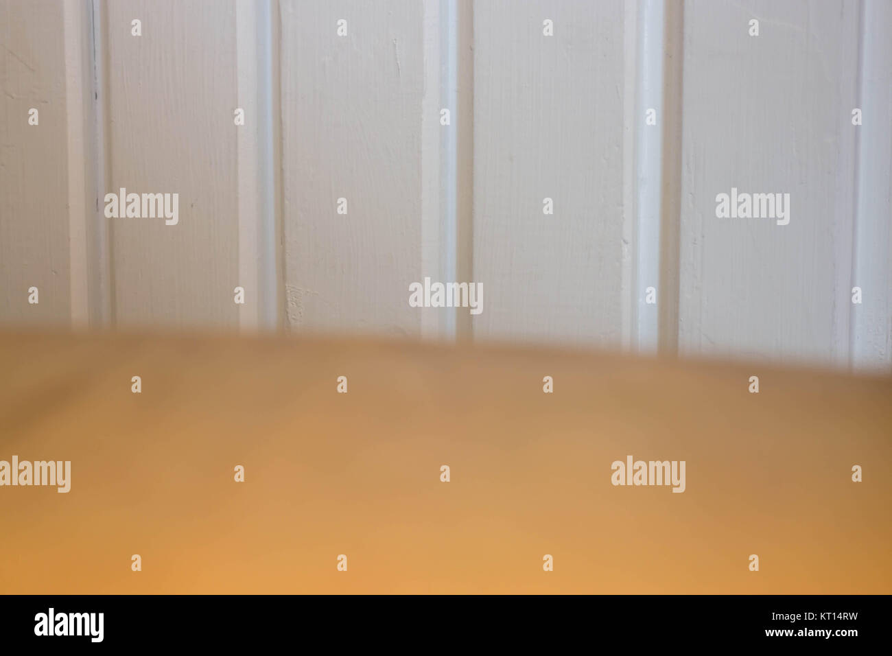 Empty wooden table over white wall Stock Photo - Alamy
