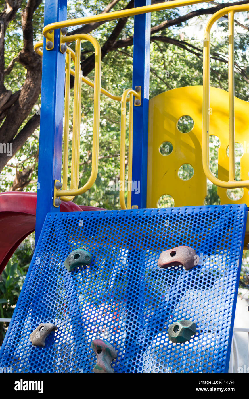 Artificial rock climbing wall at playground Stock Photo - Alamy