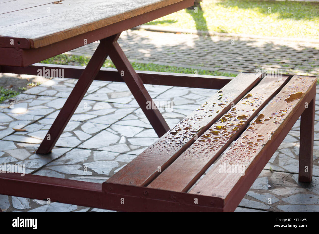 Waterdrops on bench in summer Stock Photo - Alamy