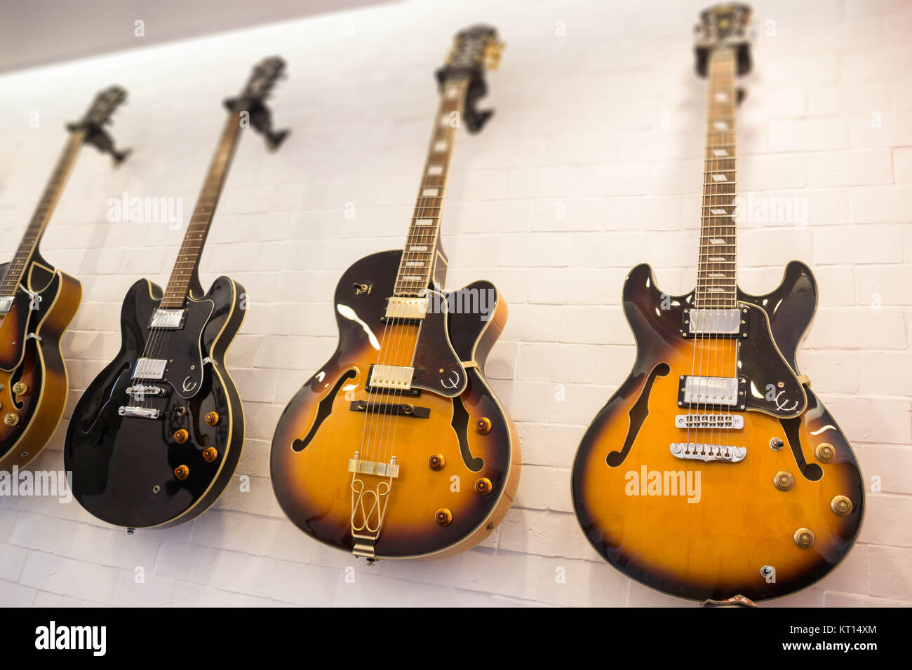 Beautiful sunburst electric guitar in the shop Stock Photo - Alamy