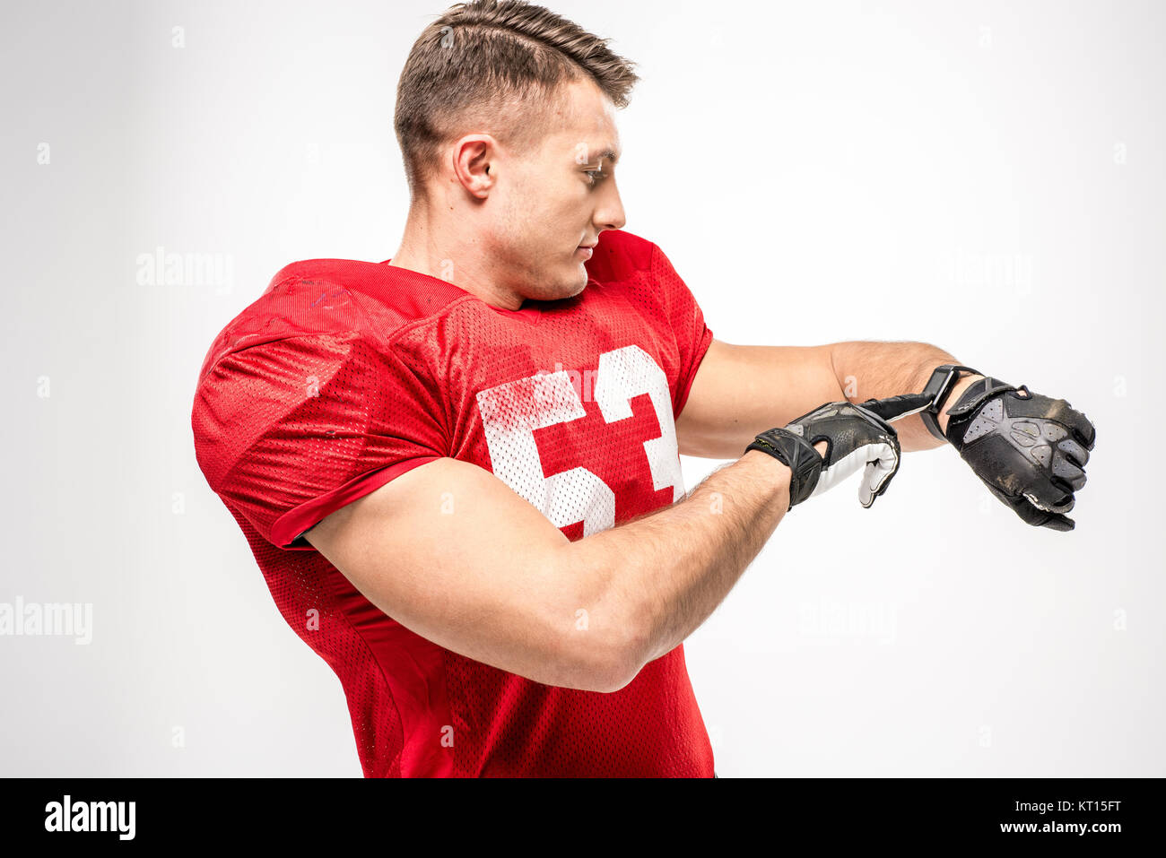 Football player pointing on smartwatch Stock Photo - Alamy