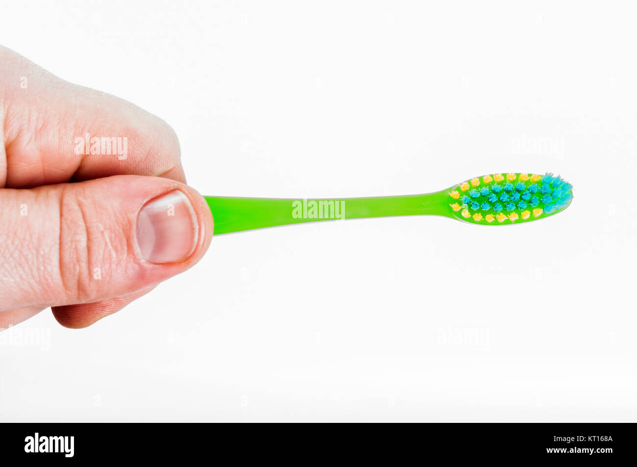 New green toothbrush. Studio shot isolated on white background Stock ...