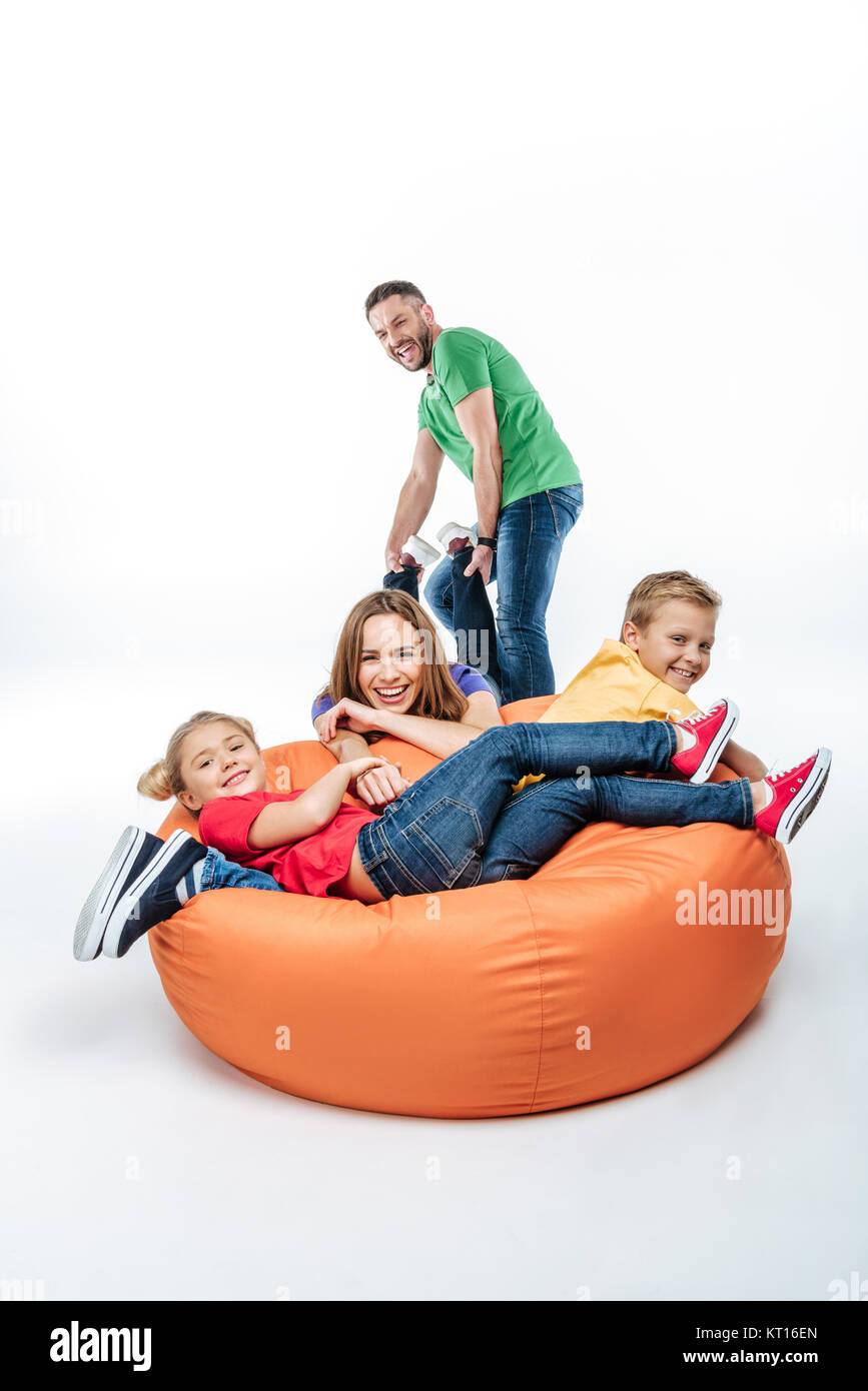Family having fun in sack-chair Stock Photo - Alamy