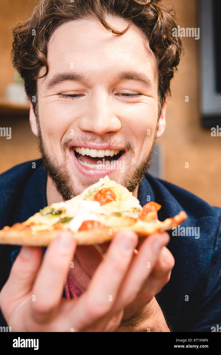 Man eating pizza Stock Photo - Alamy