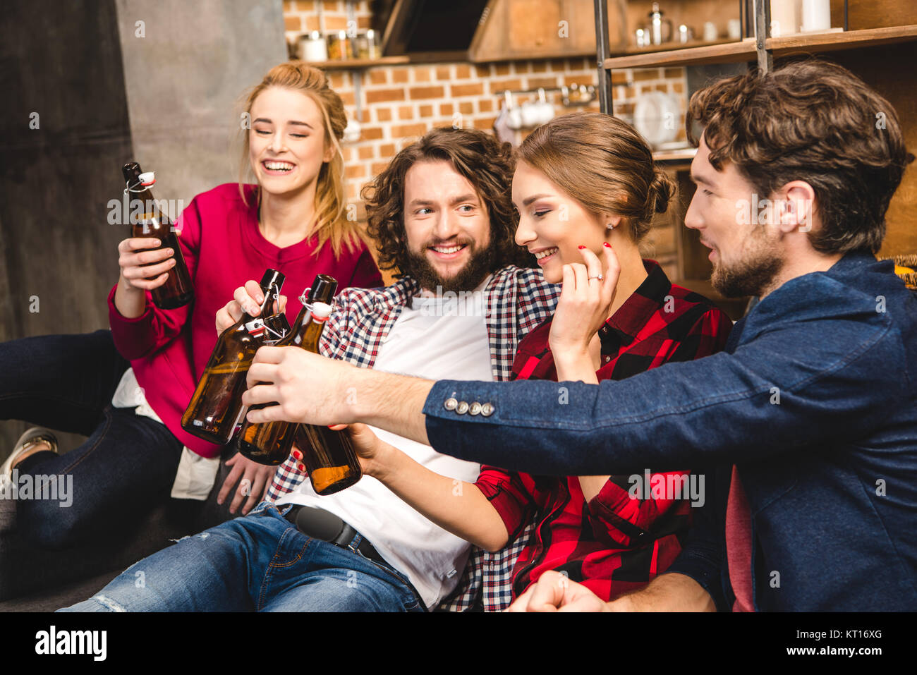 Happy friends drinking beer Stock Photo - Alamy