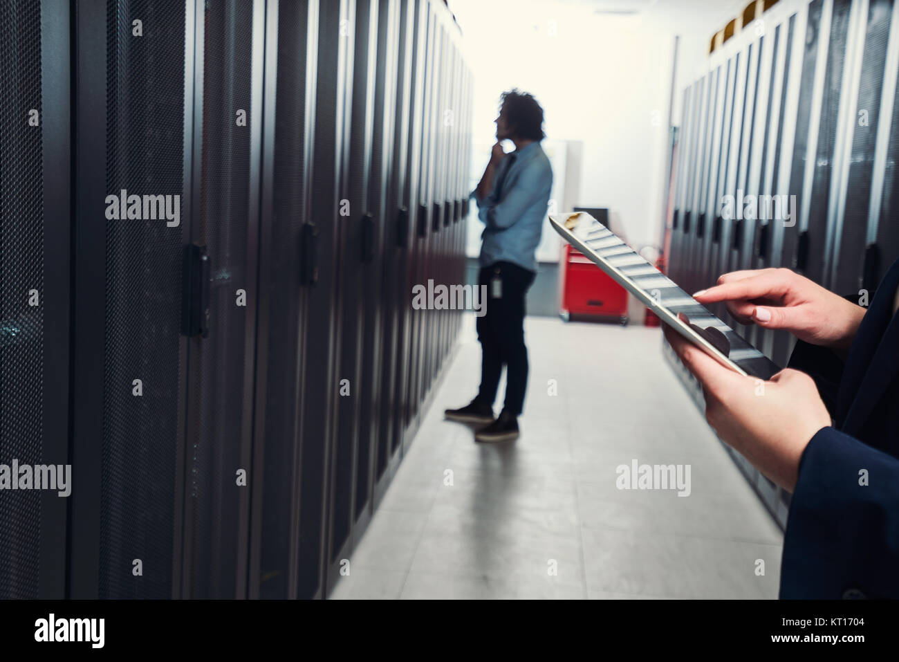 Working on tablet. server room Stock Photo - Alamy