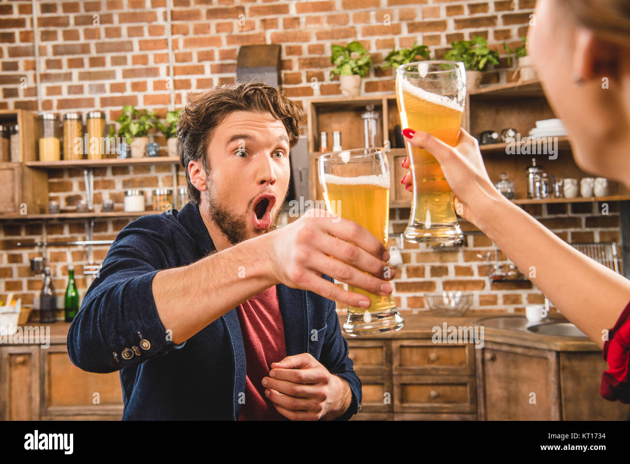 Man toasting with beer Stock Photo - Alamy