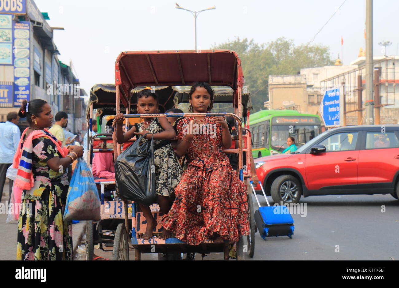 Indian children take a rickshaw in downtown New Delhi India Stock Photo ...