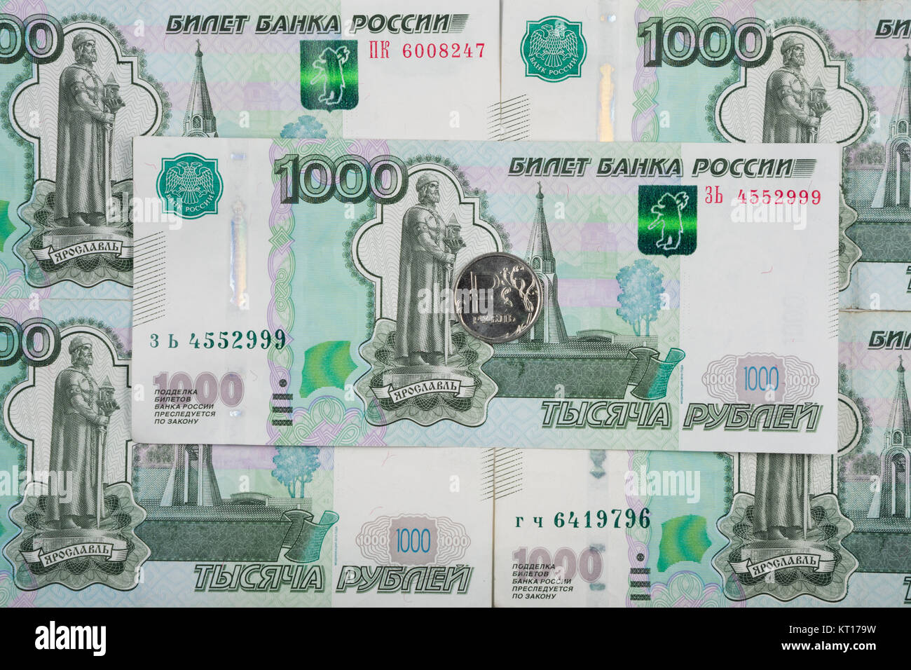 On thousandth of Russian rubles banknote is one ruble coin Stock Photo ...