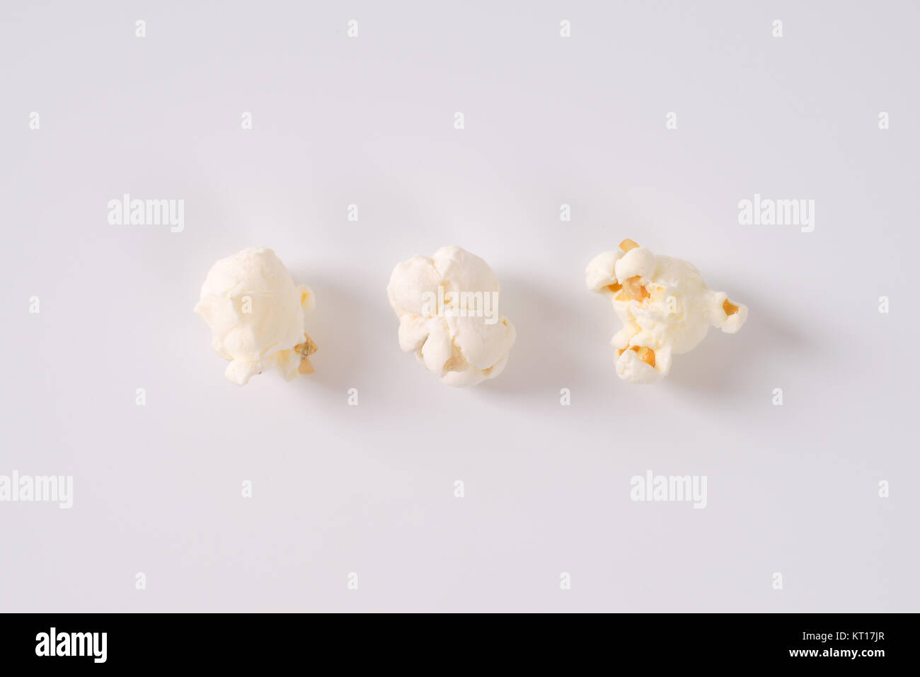 three pieces of popcorn Stock Photo - Alamy
