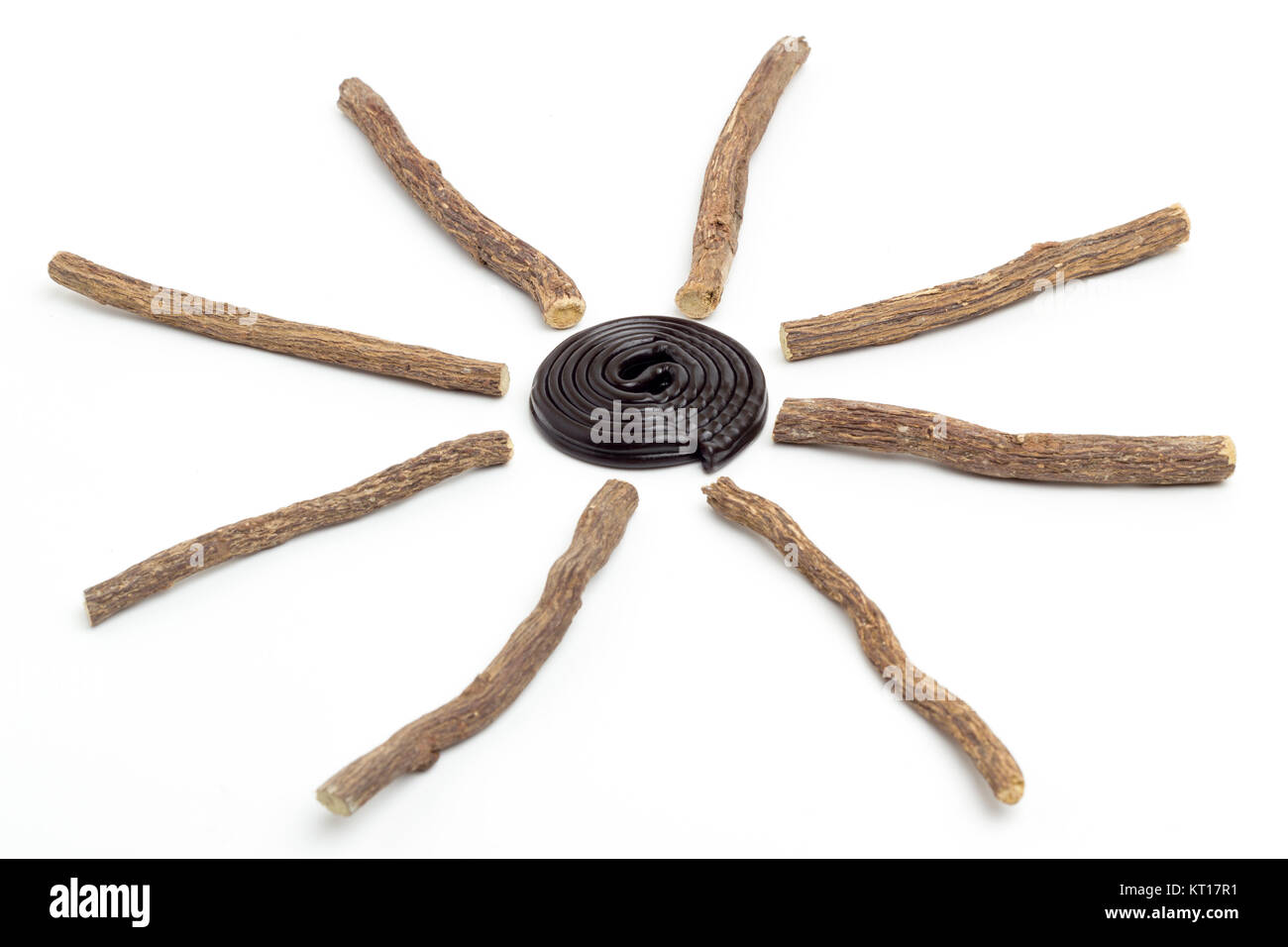 Licorice roots and wheel Stock Photo - Alamy