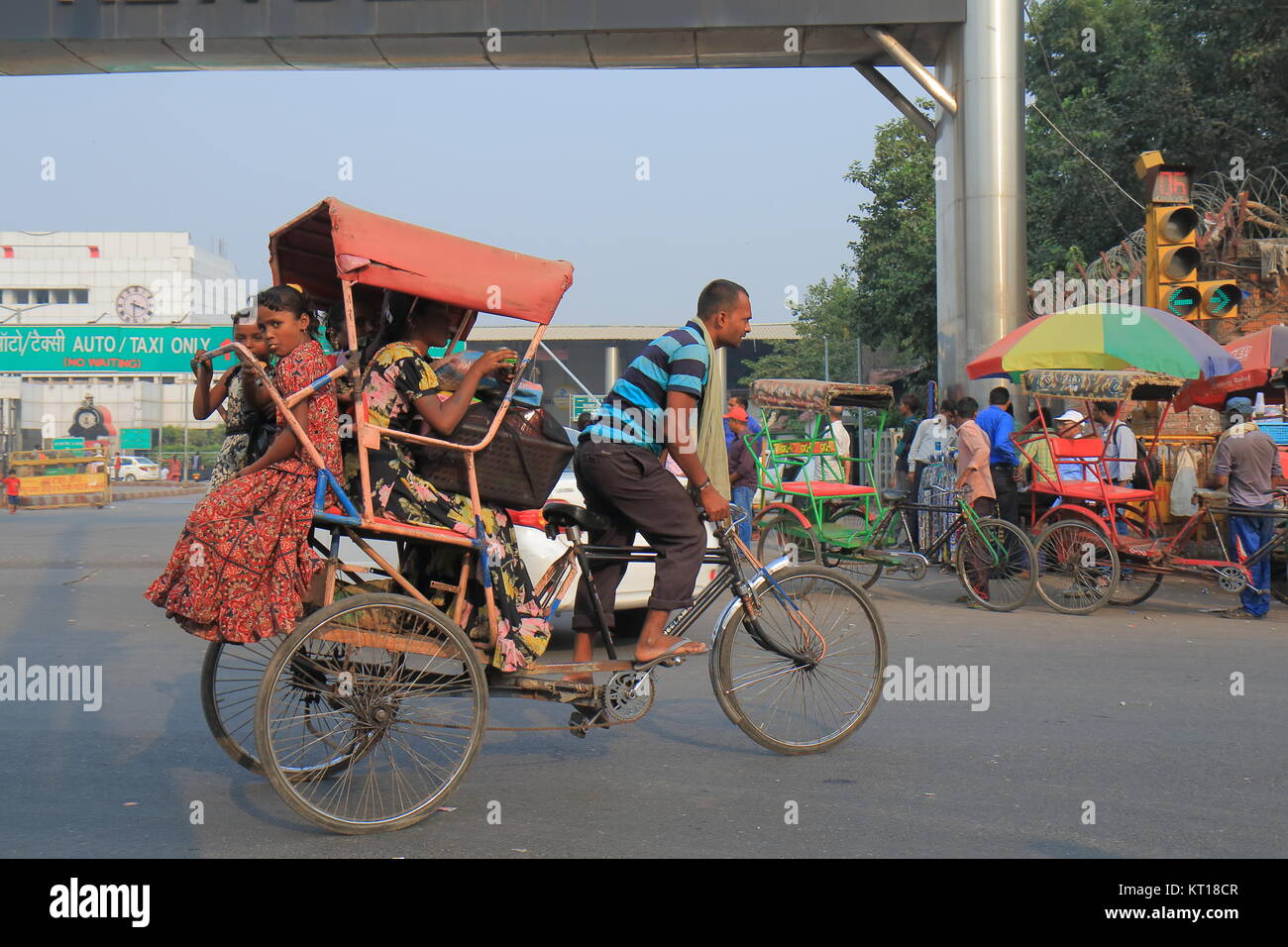 Indian children take a rickshaw in downtown New Delhi India Stock Photo ...