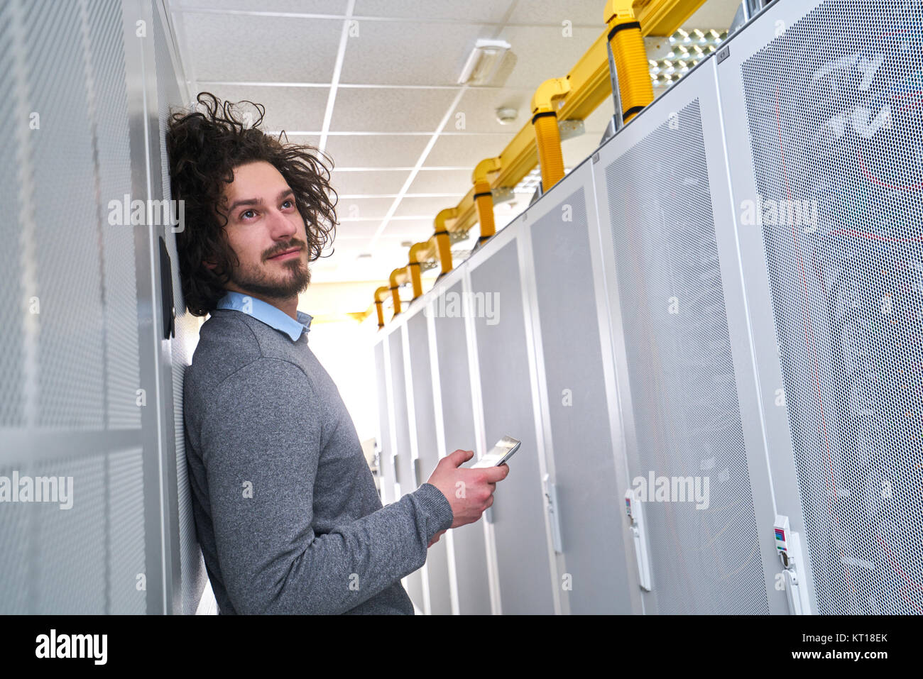 Young technician working in white server room Stock Photo - Alamy