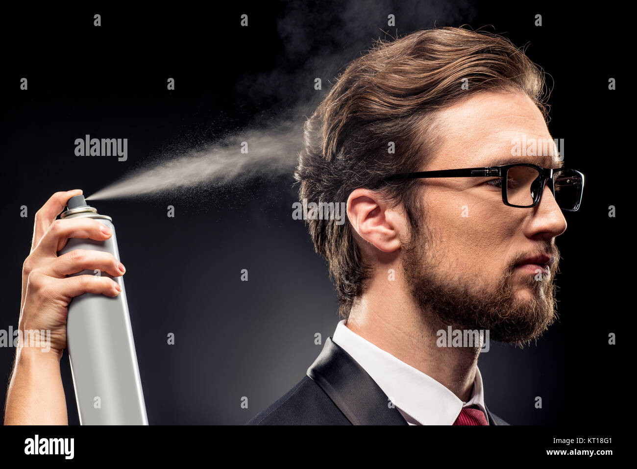 Stylist fixing hairstyle for businessman Stock Photo - Alamy