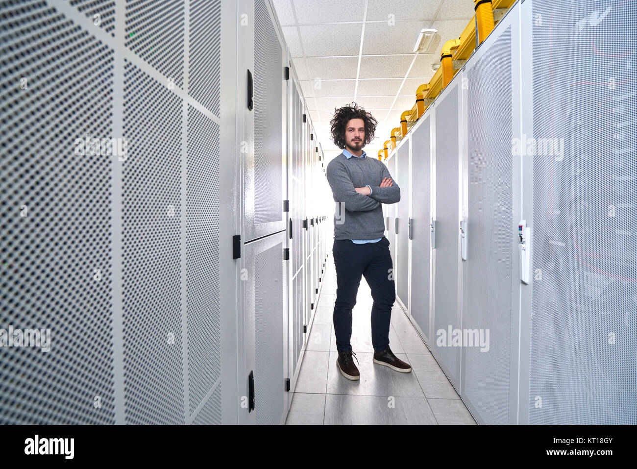 Young technician working in white server room Stock Photo - Alamy