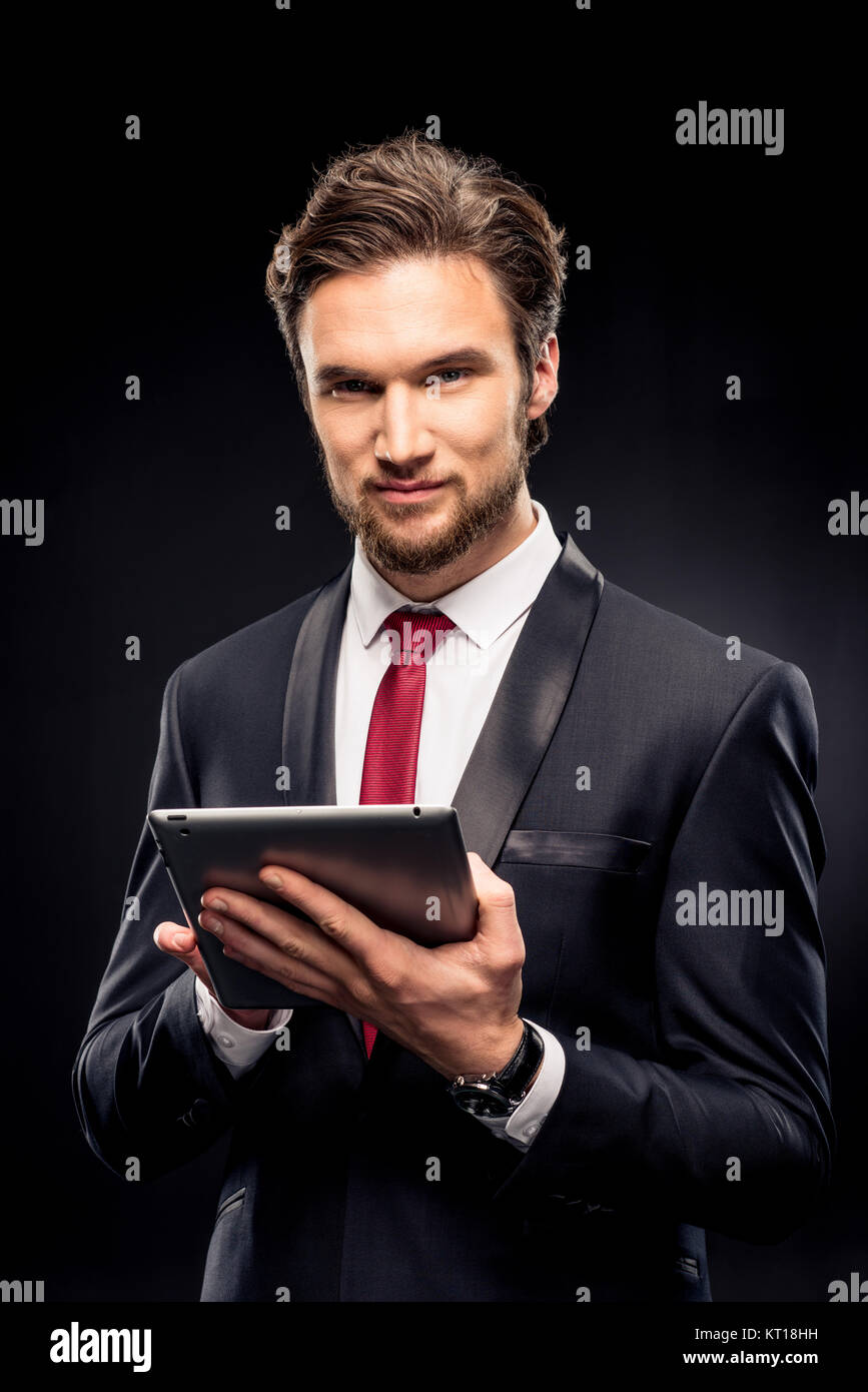 Businessman using digital tablet Stock Photo - Alamy