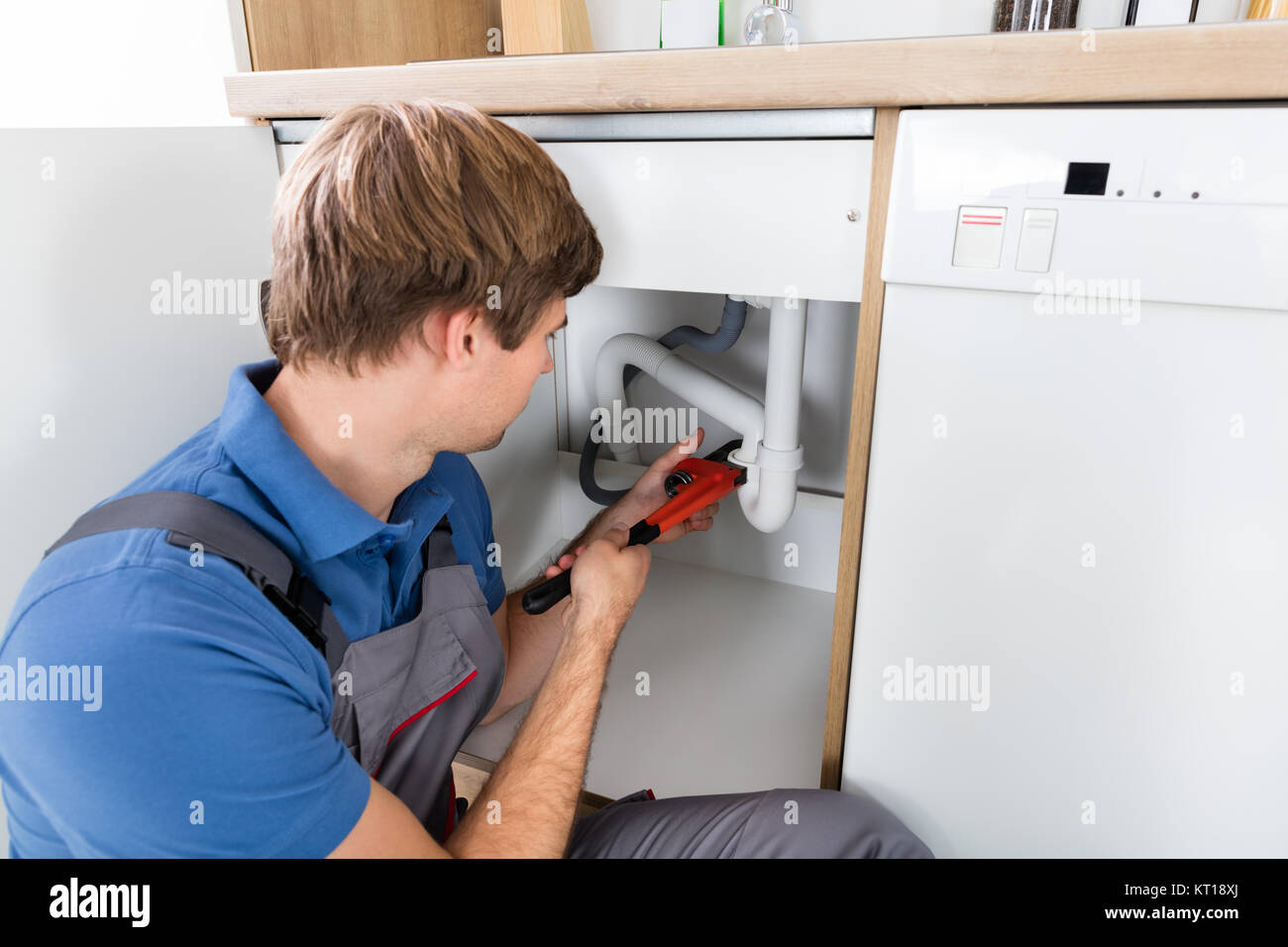 Male Plumber Fixing Sink Pipe Stock Photo - Alamy
