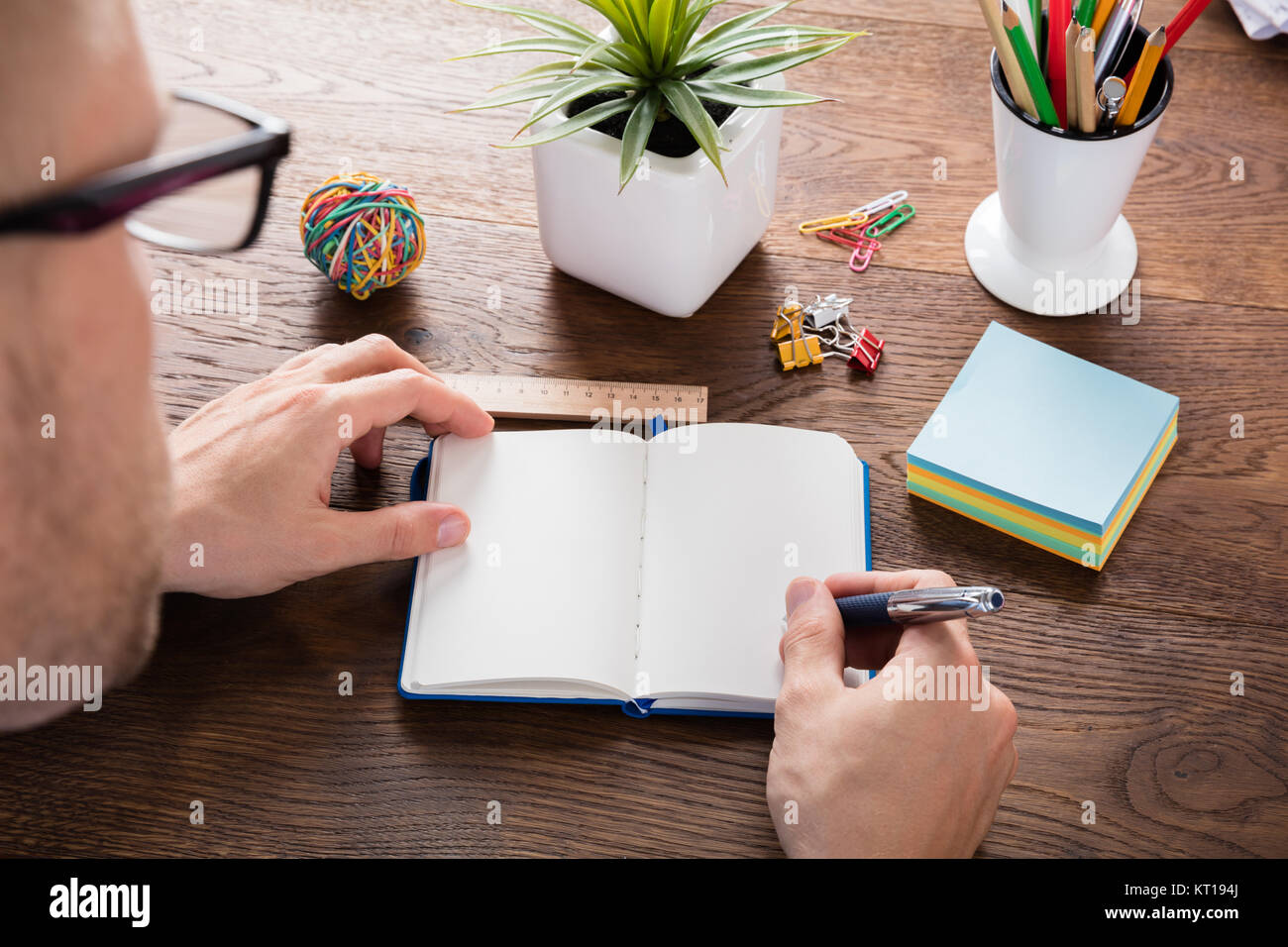 Person Writing Note In Diary Stock Photo - Alamy